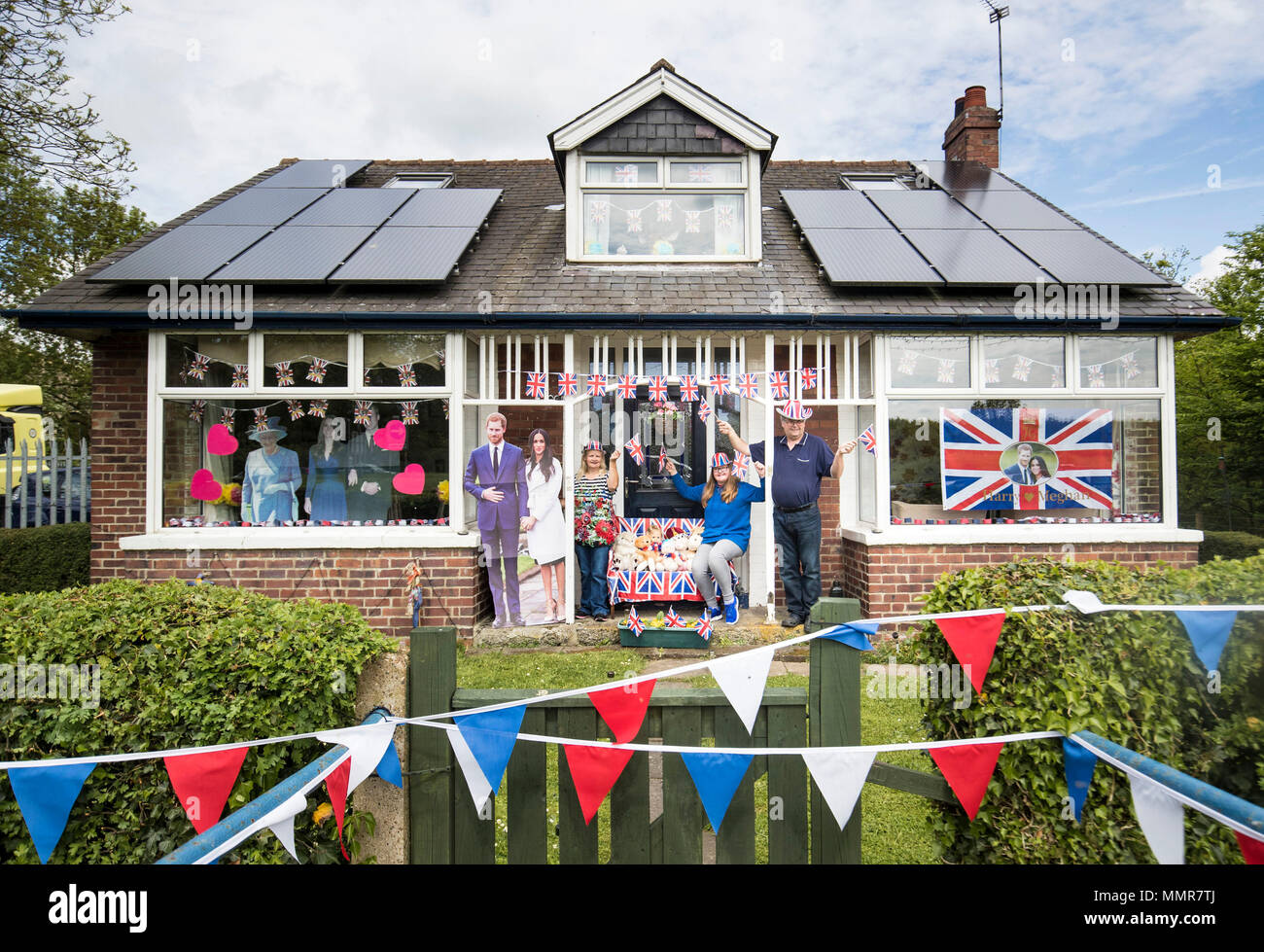 Angela and Richard Rooke and their daughter Jessica with their house ...