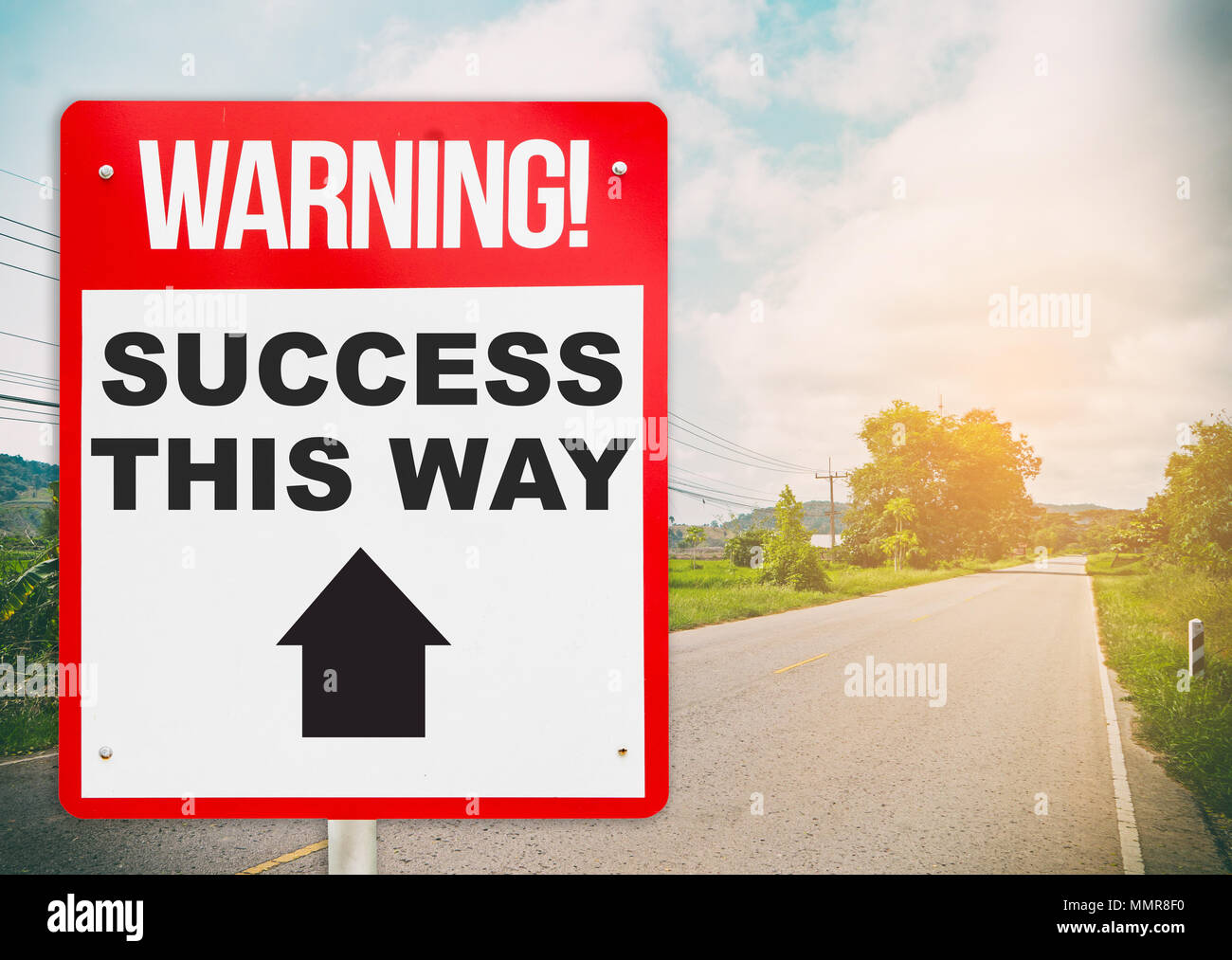 Success this way signage on bright road ahead Stock Photo - Alamy