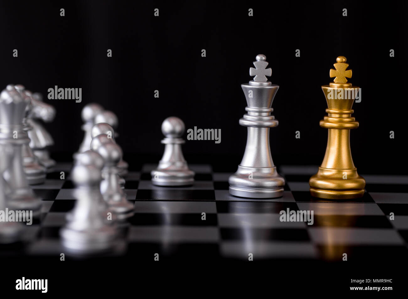 Queen chess set with enemy background Stock Photo - Alamy