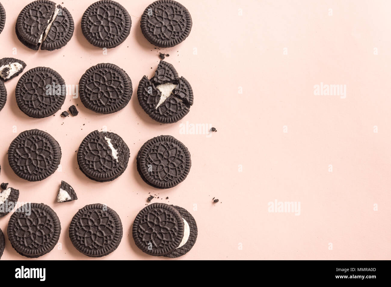 Oreo (chocolate and cream) cookies on pink pastel background, top view ...
