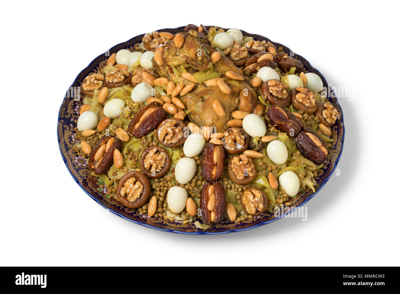 Festive traditional Moroccan Rfissa decorared with quail eggs, fruit ...