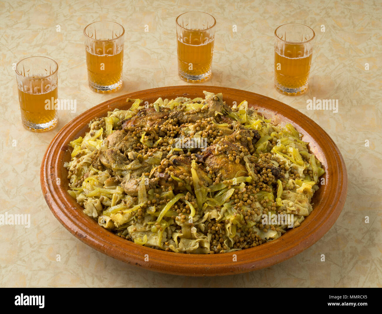 Traditional Moroccan Rfissa served with tea Stock Photo - Alamy