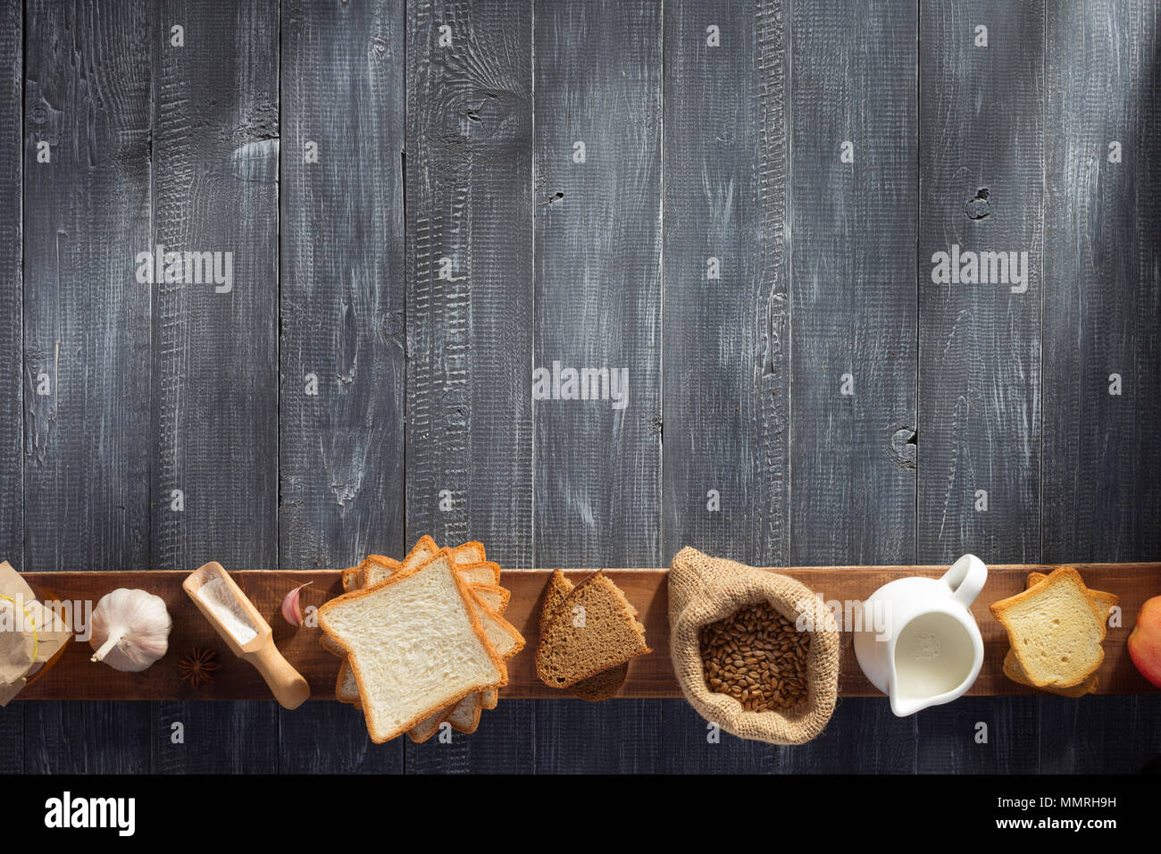 bread and bakery products on wood background Stock Photo - Alamy