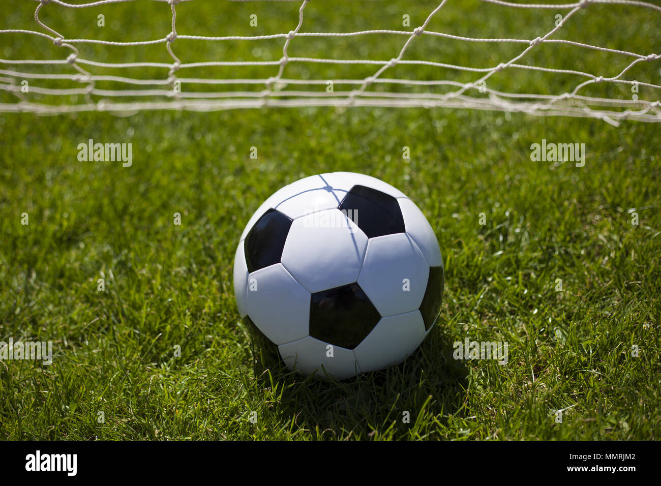 Football in the back of the net hi-res stock photography and images - Alamy