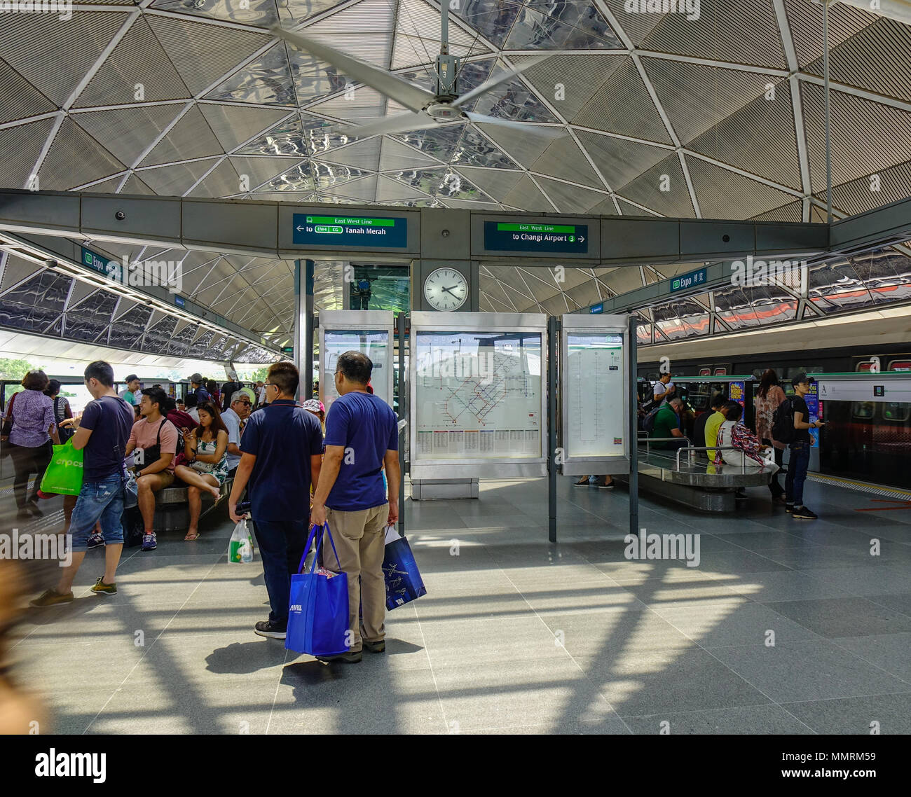 Singapore - Feb 11, 2018. People waiting at MRT station in Singapore ...