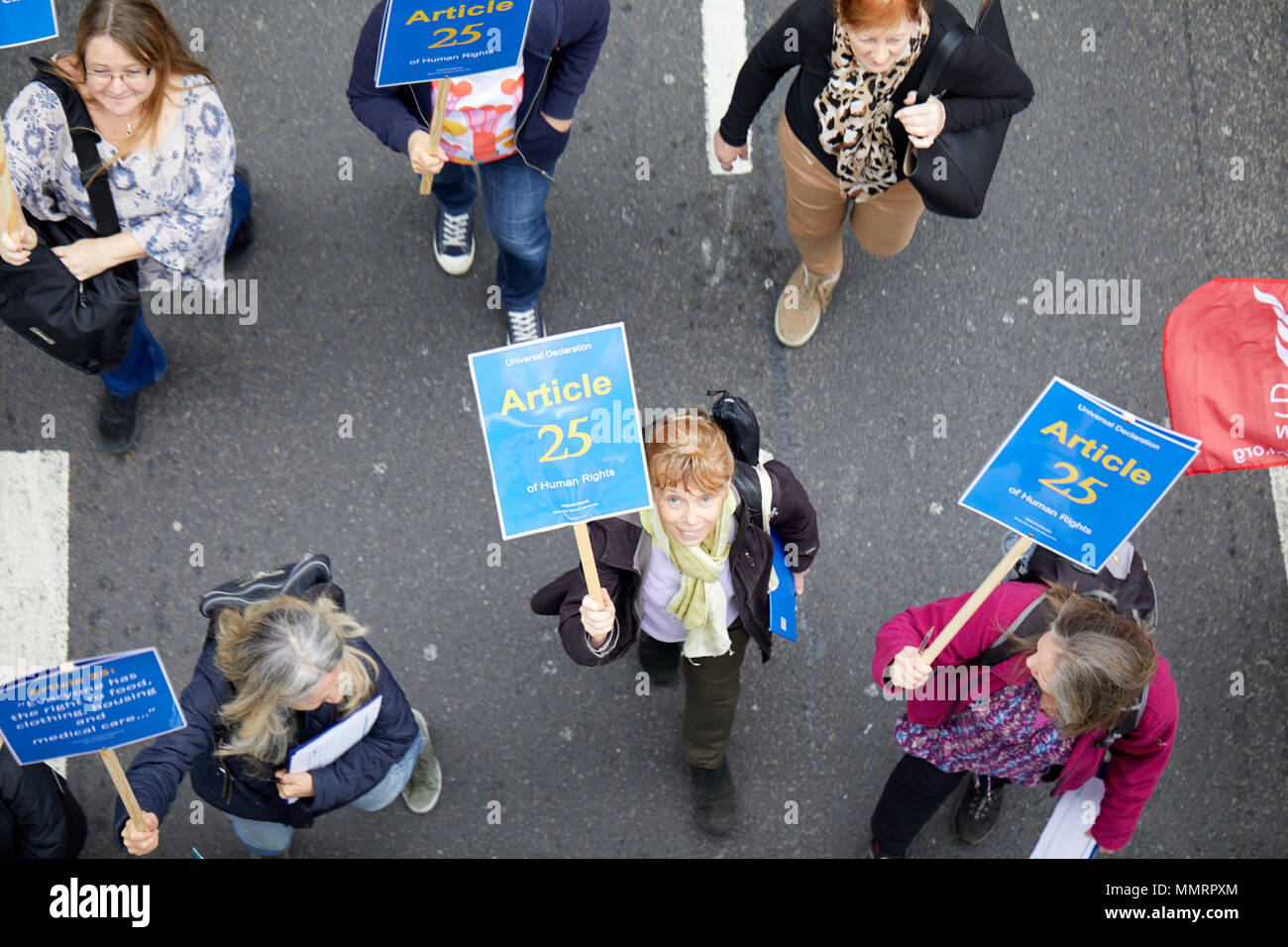 A protestor in support of Article 25, the United Nation's Universal ...