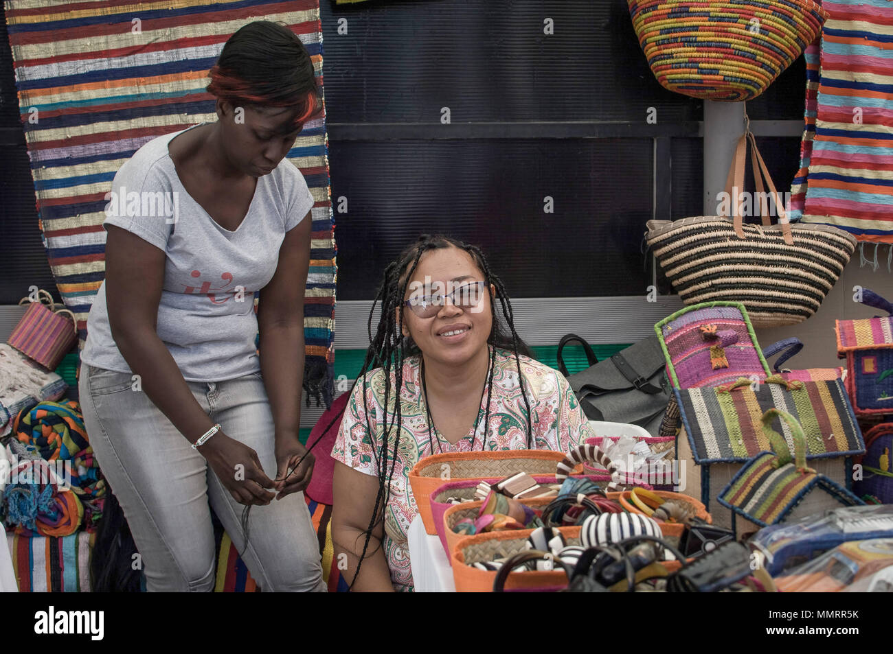Athens, Greece. 1st Jan, 2006. An African woman seen making braids to ...
