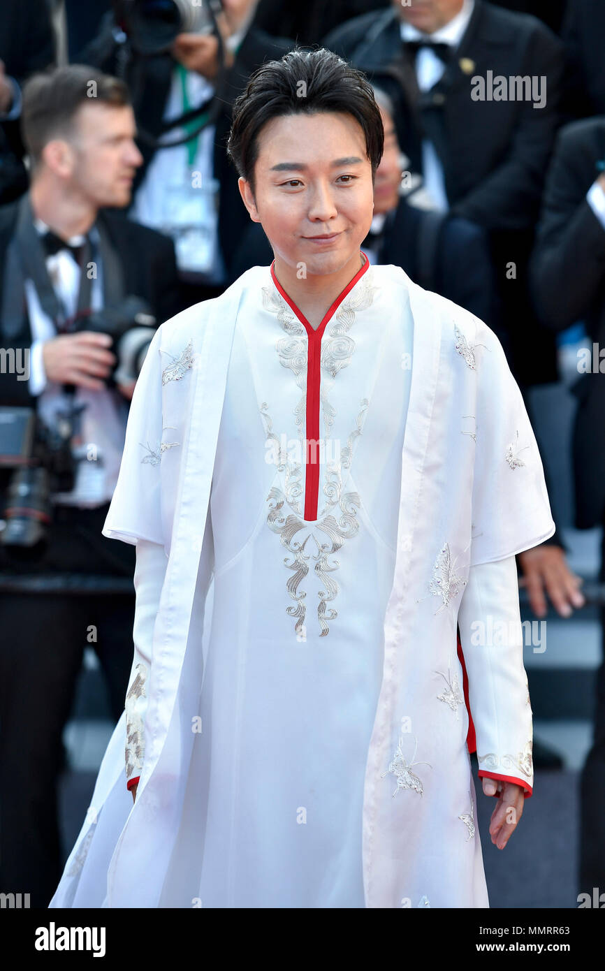 Cannes, France. 12th May, 2018. Chinese singer Li Yugang poses on the red carpet during the ...