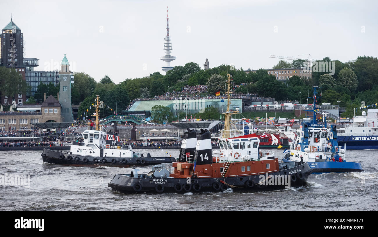 12 May 2018, Germany, Hamburg: Harbour tugs perform a 'Harbour tug ...