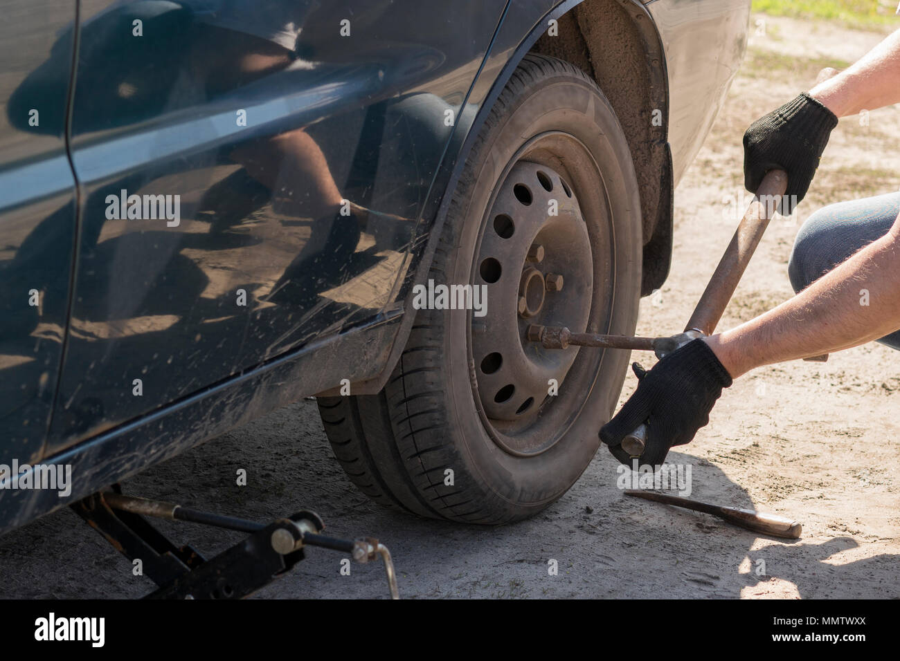 Man changing wheel after a car breakdown. Transportation, traveling ...