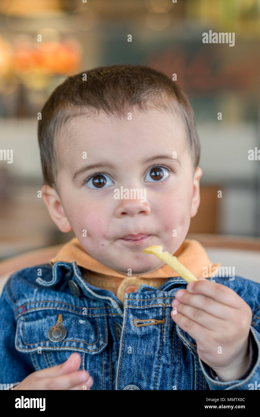 Eats french fries hi-res stock photography and images - Alamy