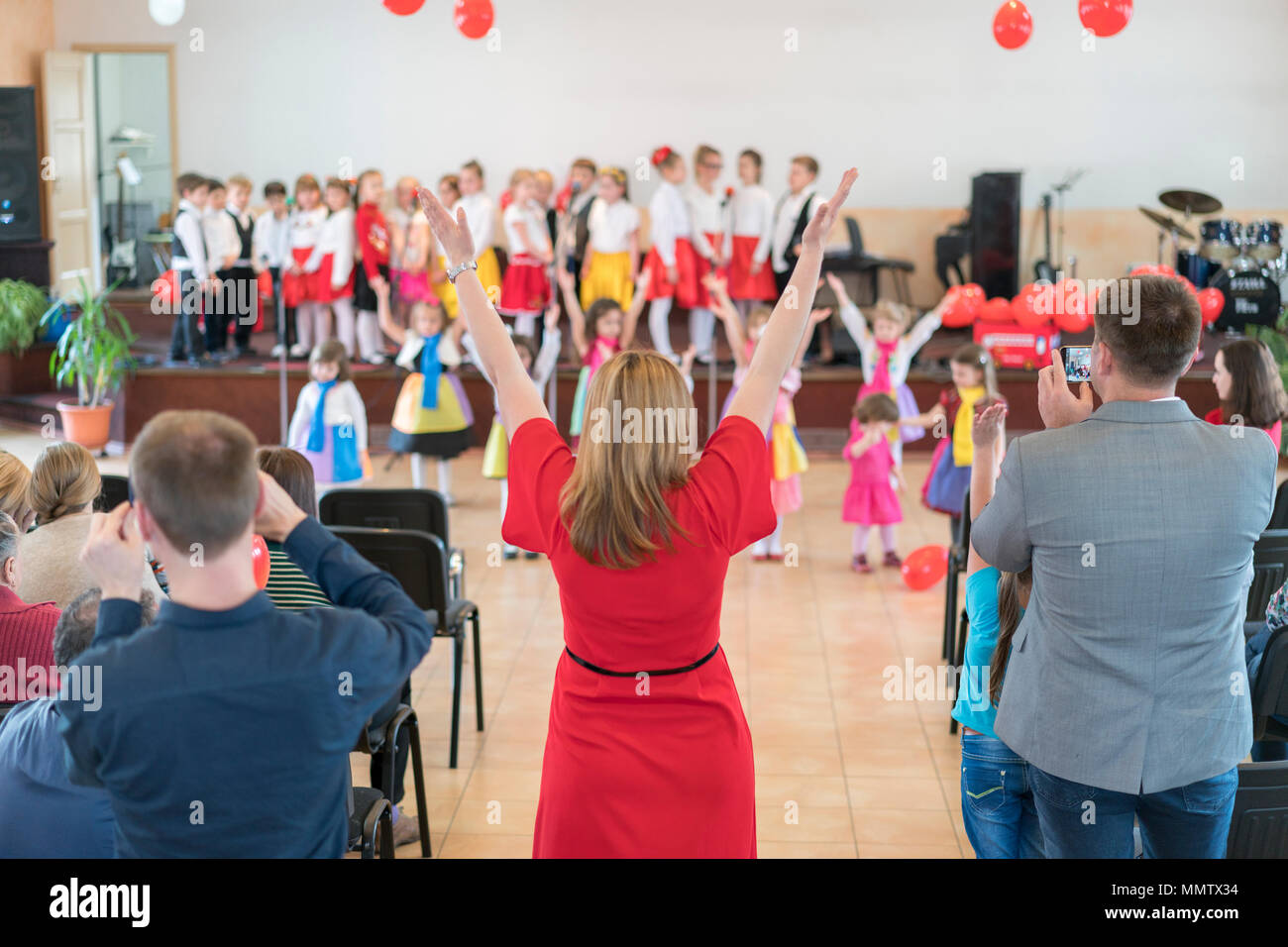 image of blur kid 's show on stage at school , for background usage ...