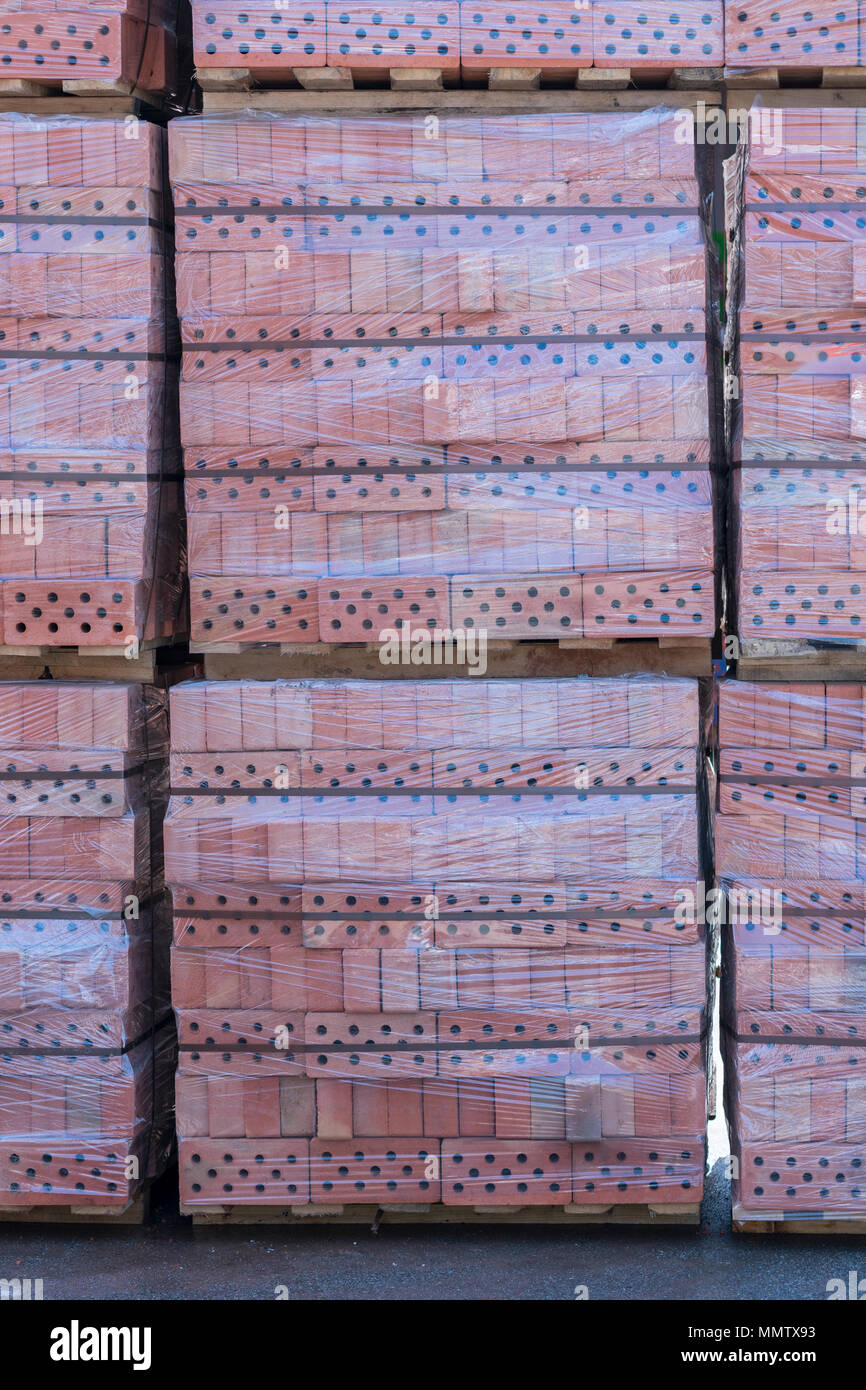 Clay brick's pallet at the storage yard. pallets with bricks in the ...
