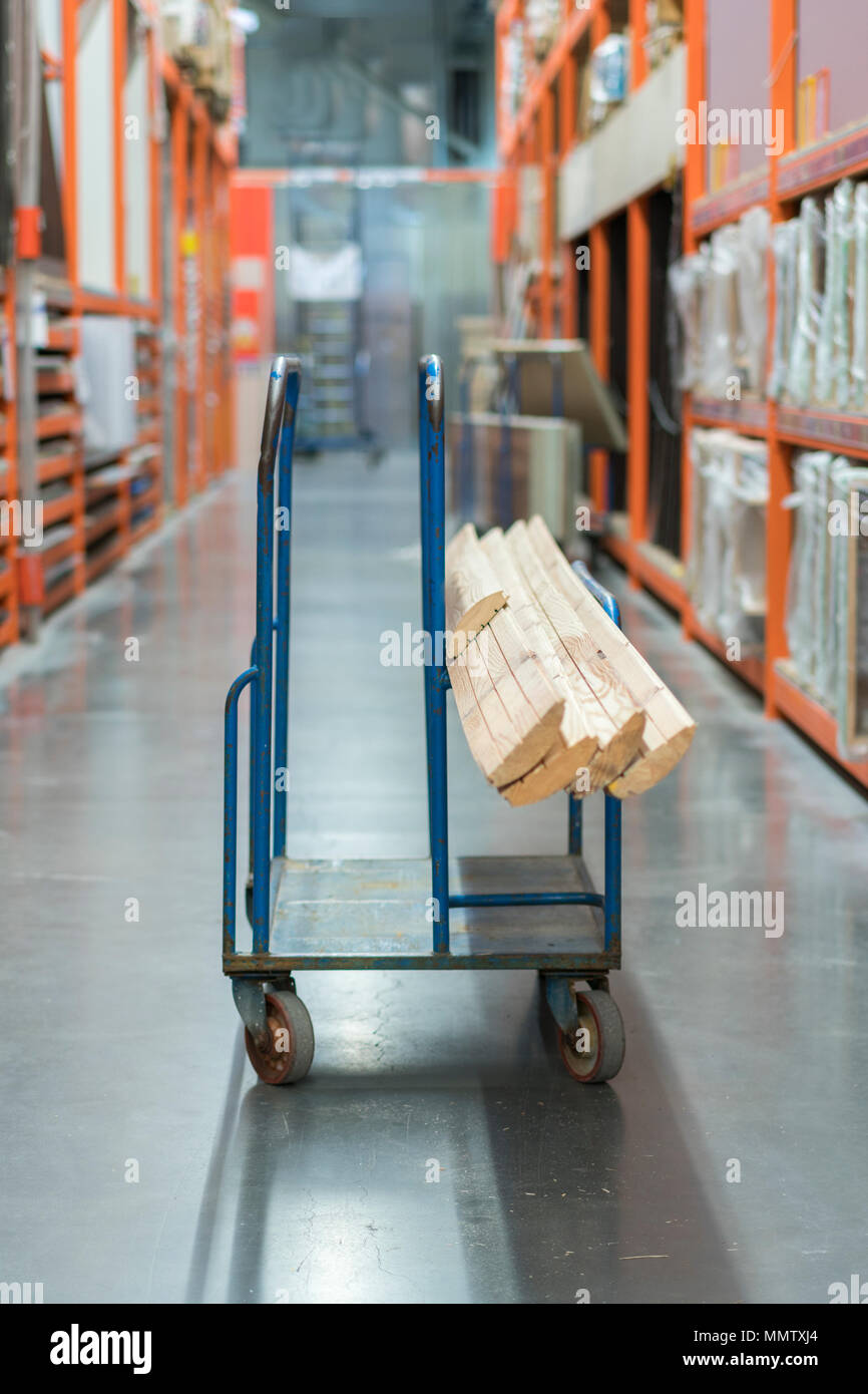 construction cart in the building store. Carts loaded with boards Stock ...