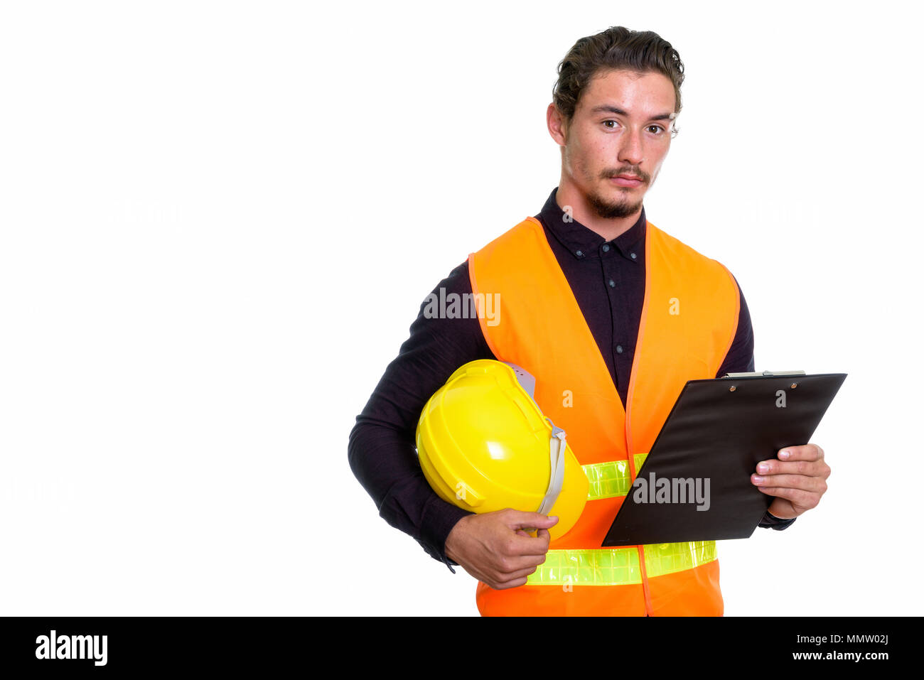 Studio shot of young handsome man construction worker holding ha Stock ...