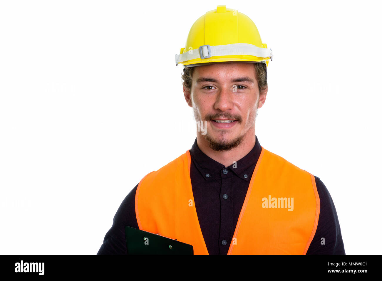 Close up of young happy man construction worker smiling while ho Stock ...