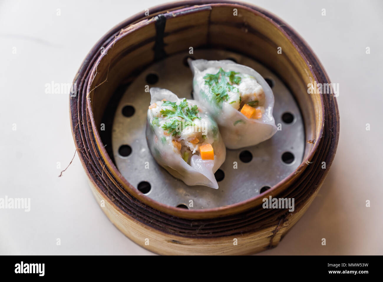 Chinese dim sum in wooden basket Stock Photo - Alamy