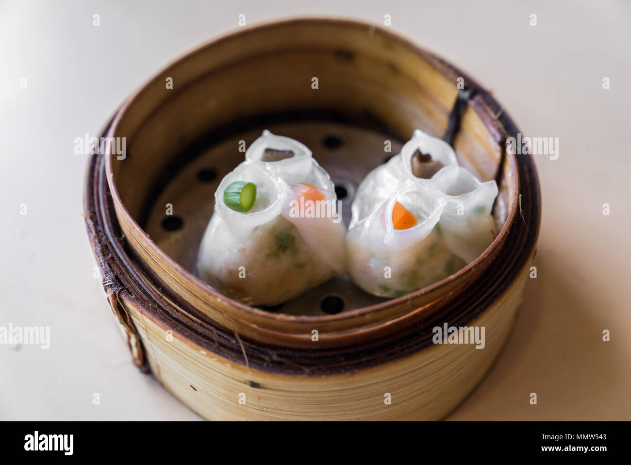 Chinese dim sum in wooden basket Stock Photo - Alamy