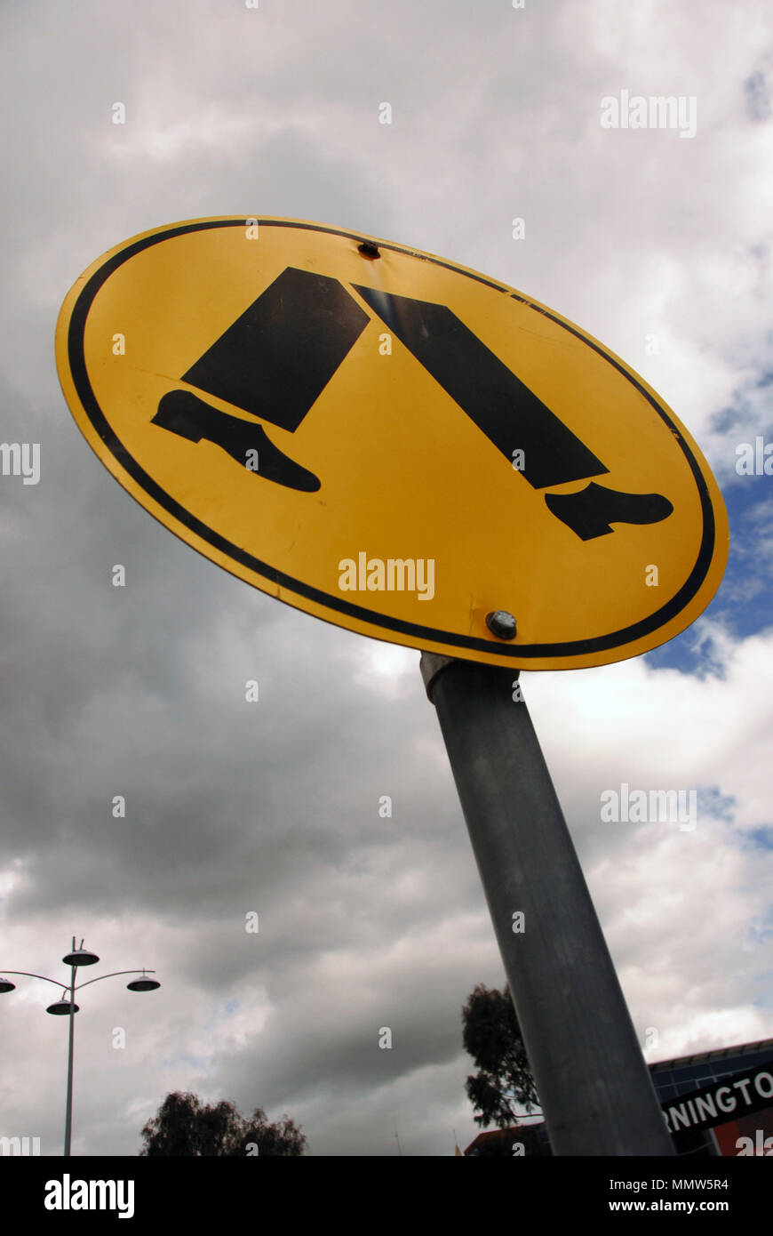 yellow circular public walking sign in Australia Stock Photo - Alamy