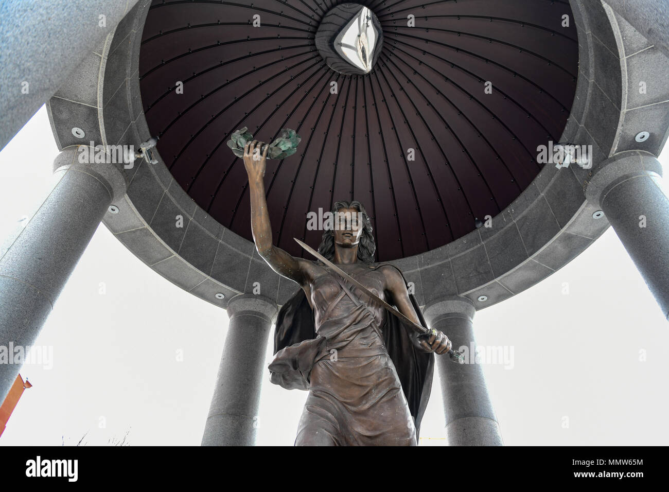 The bronze Lady Victory sculpture featuring a sword and wreath of peace ...