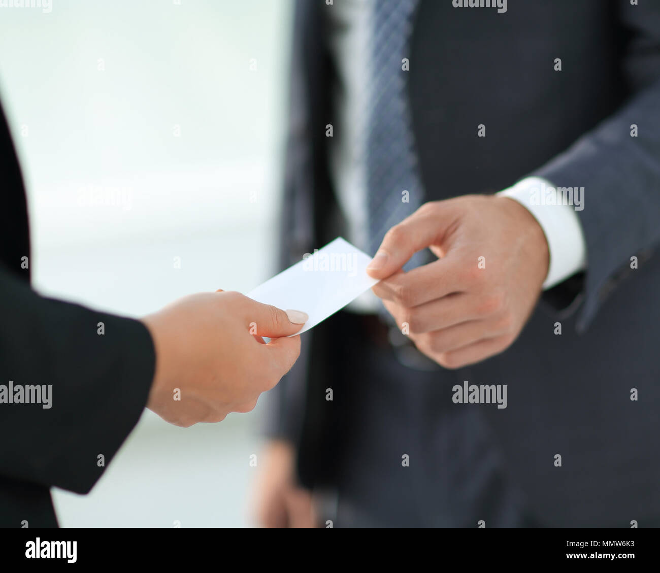Exchange business card for first time meet Stock Photo - Alamy