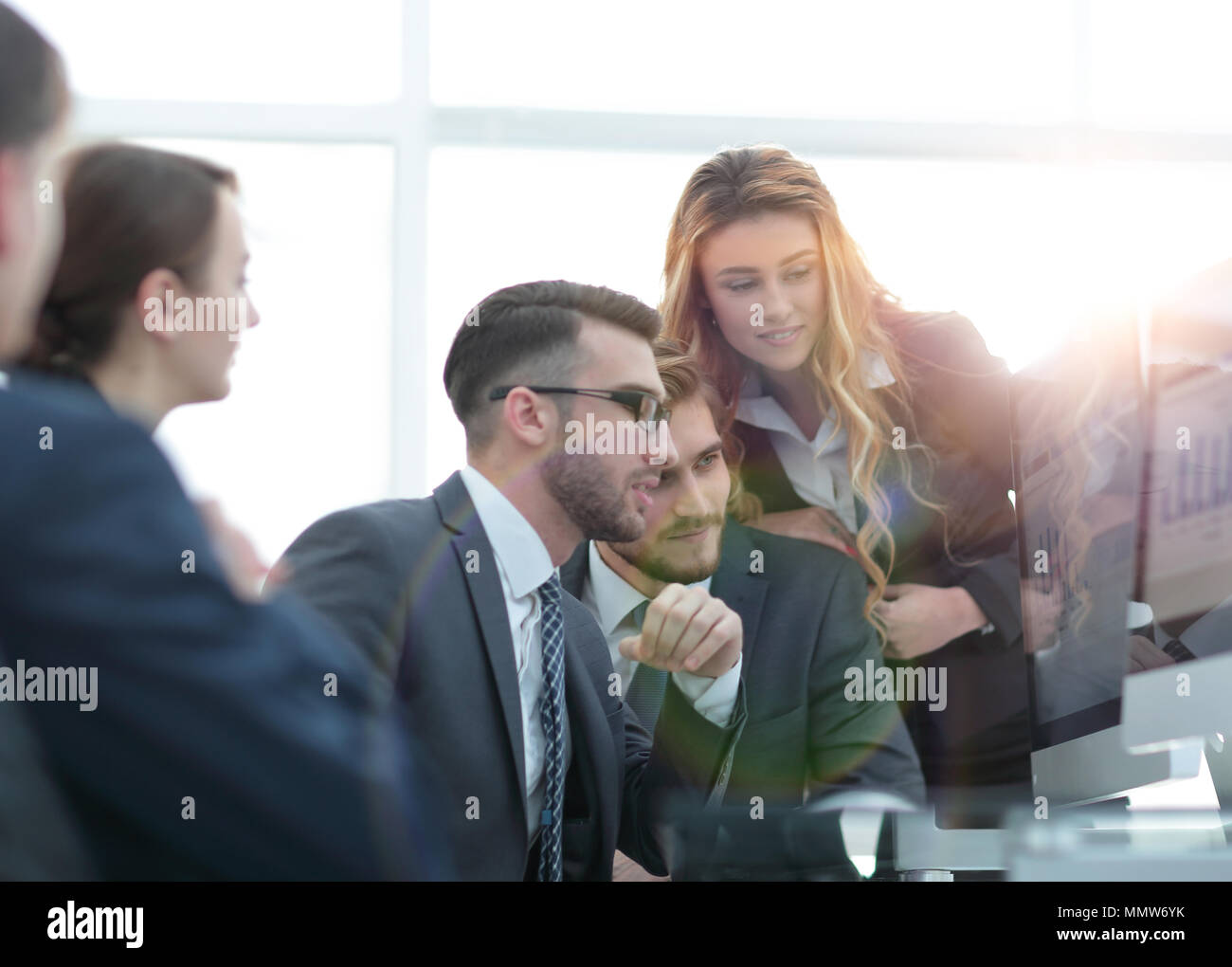 employees discussing financial charts Stock Photo - Alamy