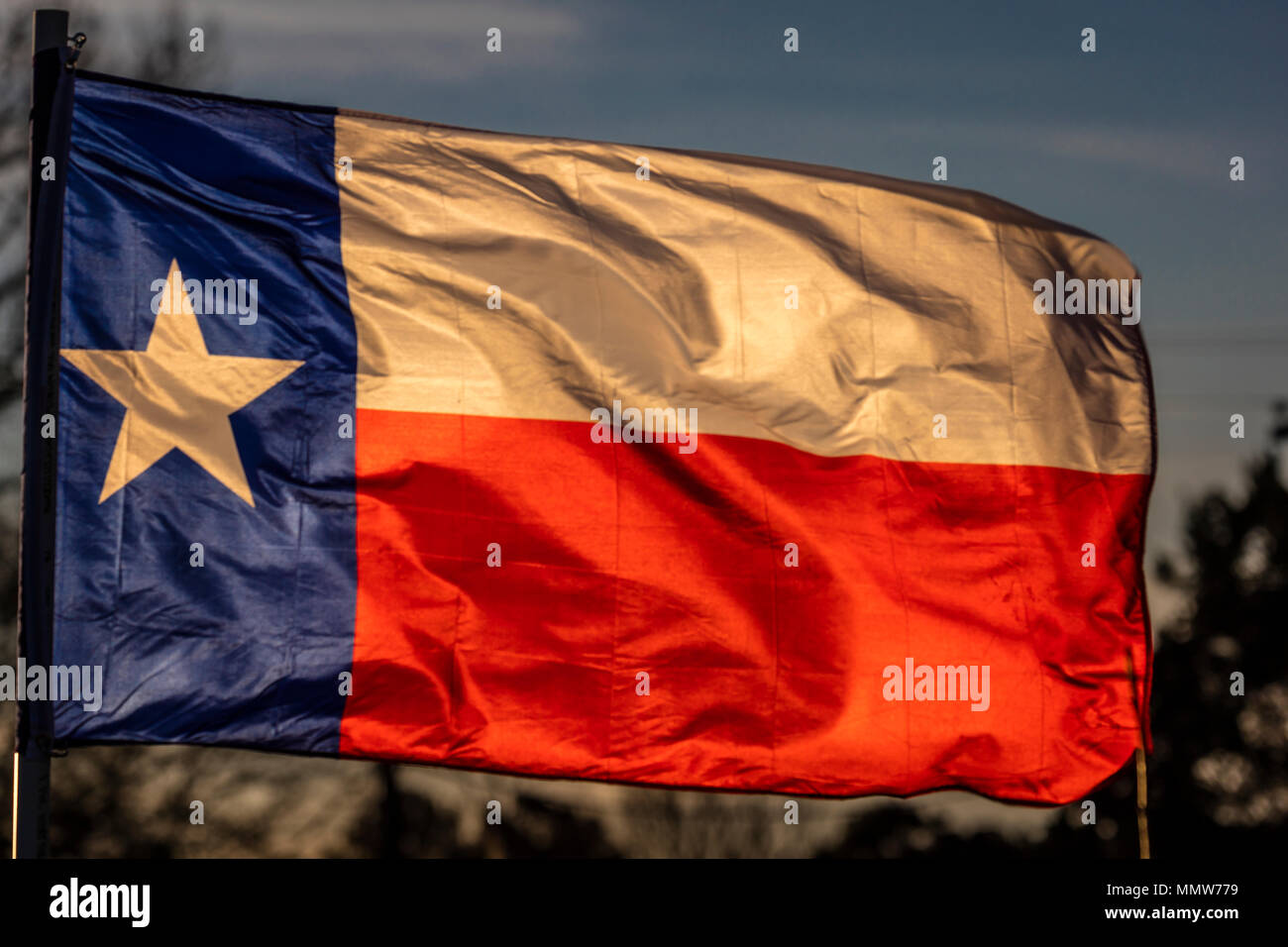 Texas flag waving in wind hi-res stock photography and images - Alamy