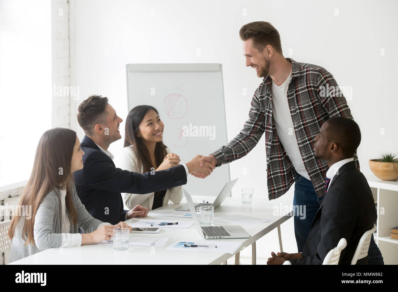 Welcoming customer hi-res stock photography and images - Alamy