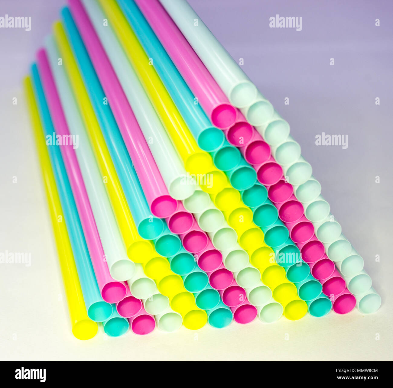 Many colorful straws stacked on top of each other Stock Photo - Alamy