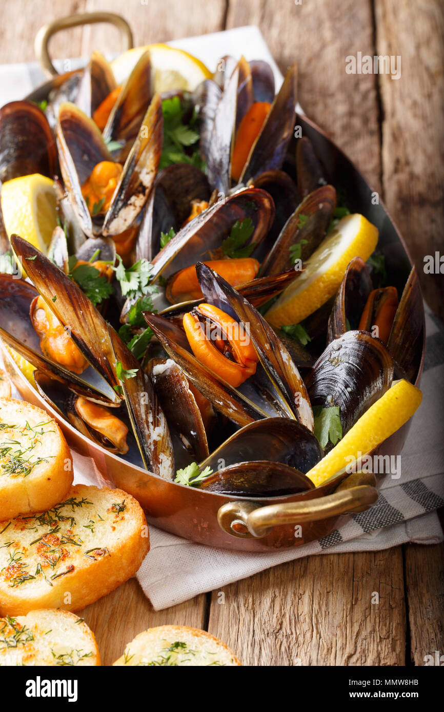 Mussels in wine with parsley and lemon. Seafood. Clams in the shells ...
