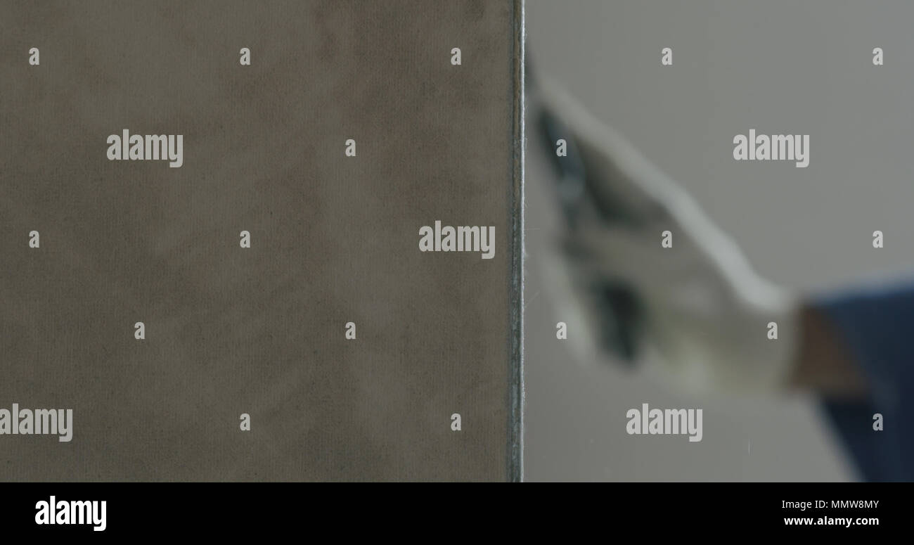 worker applying putty on the wall with copy space, wide photo Stock ...