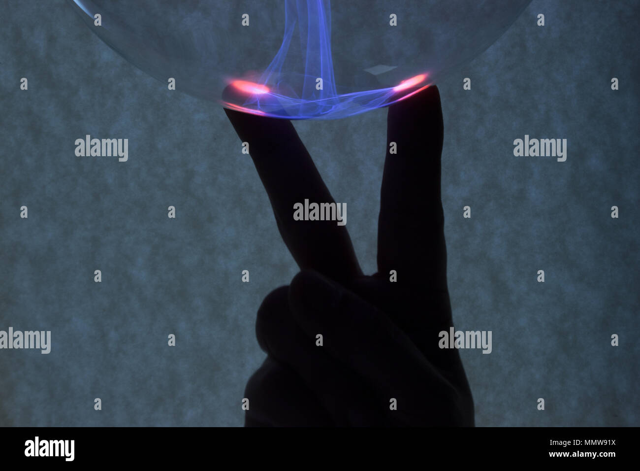 In the background is the hand that was illuminated by plasma from ...
