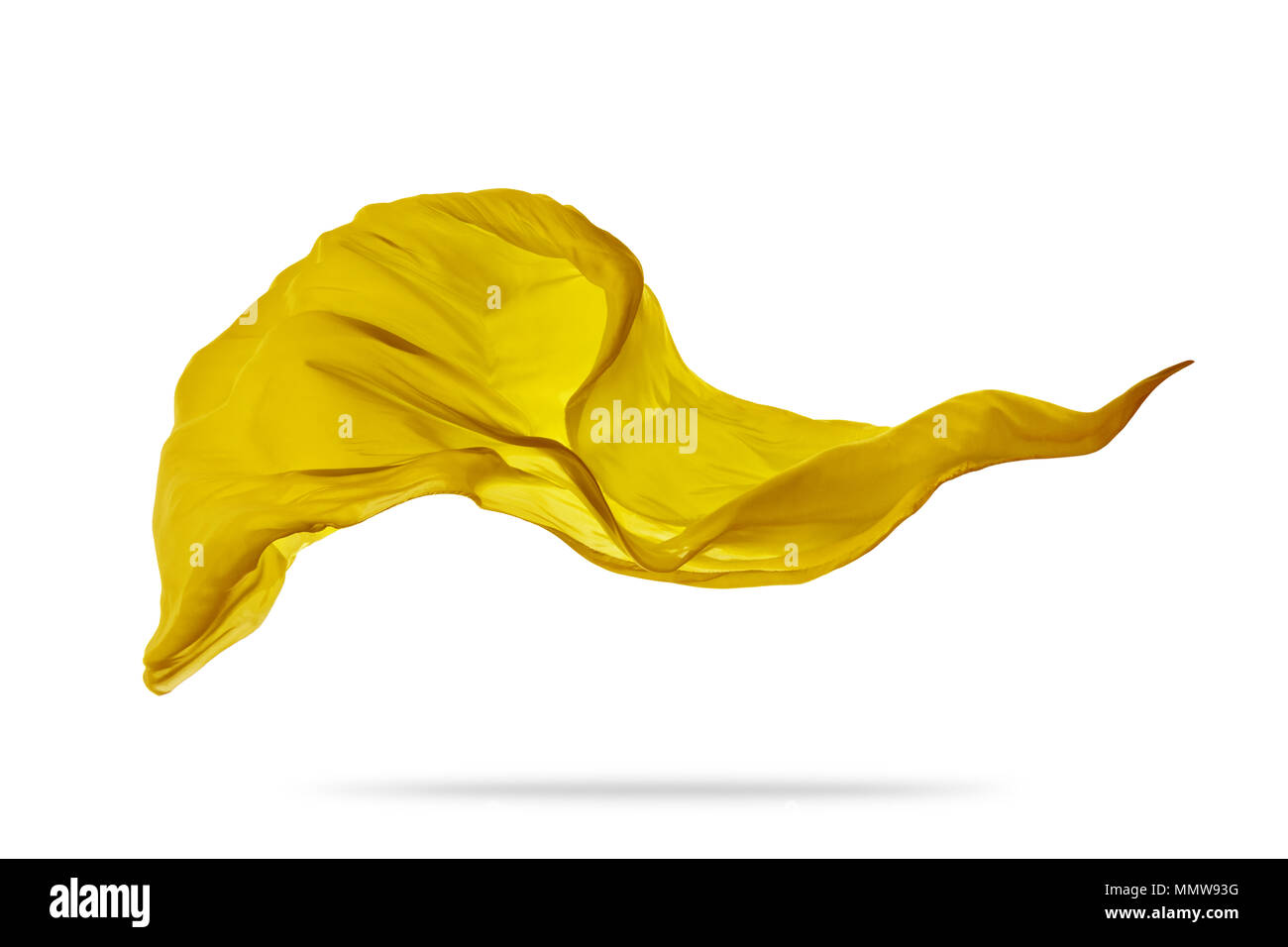 Piece of flying golden cloth isolated on white background. High ...