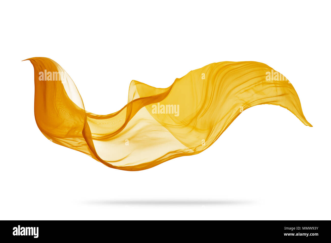 Piece of flying golden cloth isolated on white background. High ...