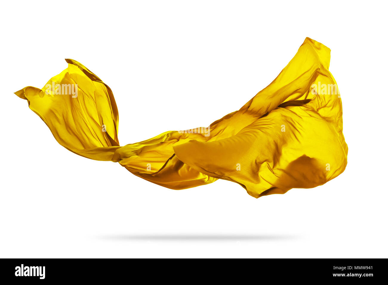 Piece of flying golden cloth isolated on white background. High ...