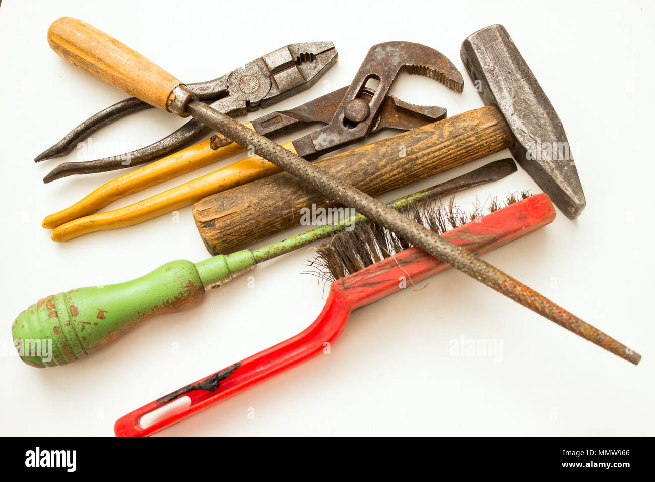 Old rusty tools must be replaced with new ones Stock Photo - Alamy