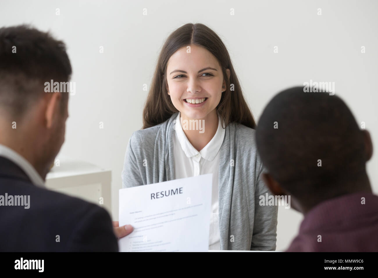 Happy smiling millennial job applicant being interviewed by hr t Stock ...