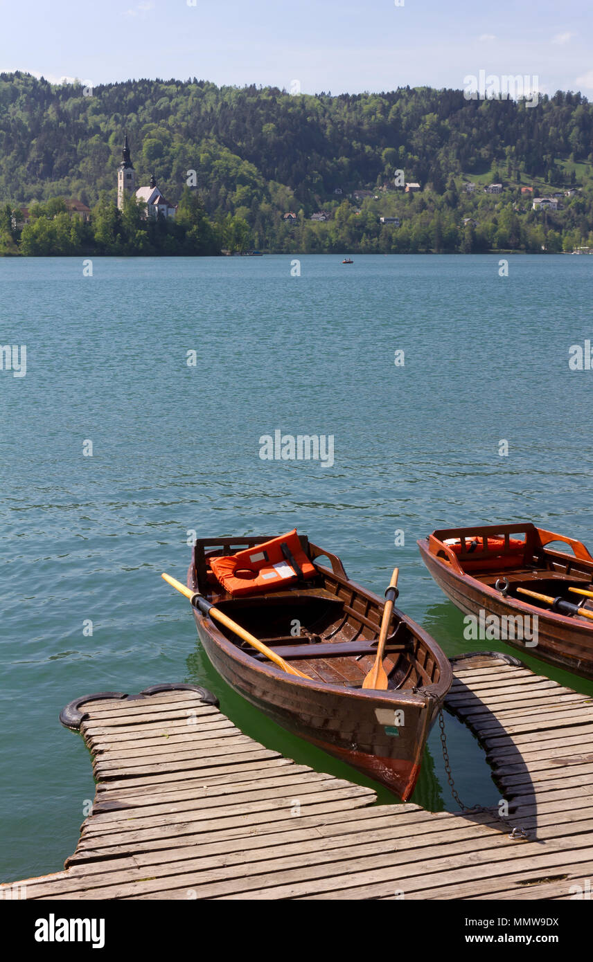 Wooden rowboats moored at lake Bled, Slovenia Stock Photo - Alamy