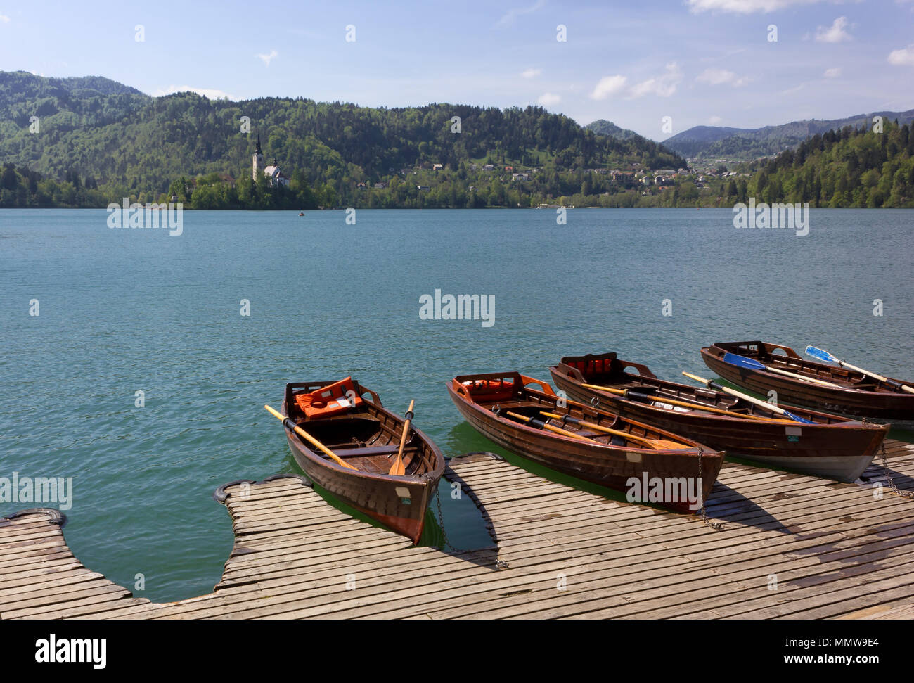 Wooden rowboats moored at lake Bled, Slovenia Stock Photo - Alamy
