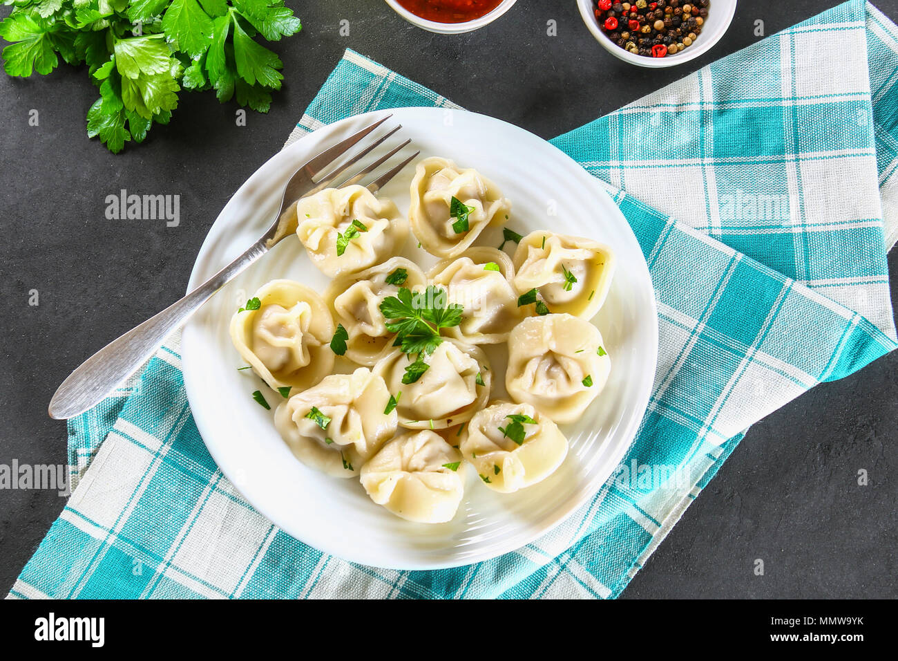 Homemade ready dumplings on a gray concrete table Stock Photo - Alamy