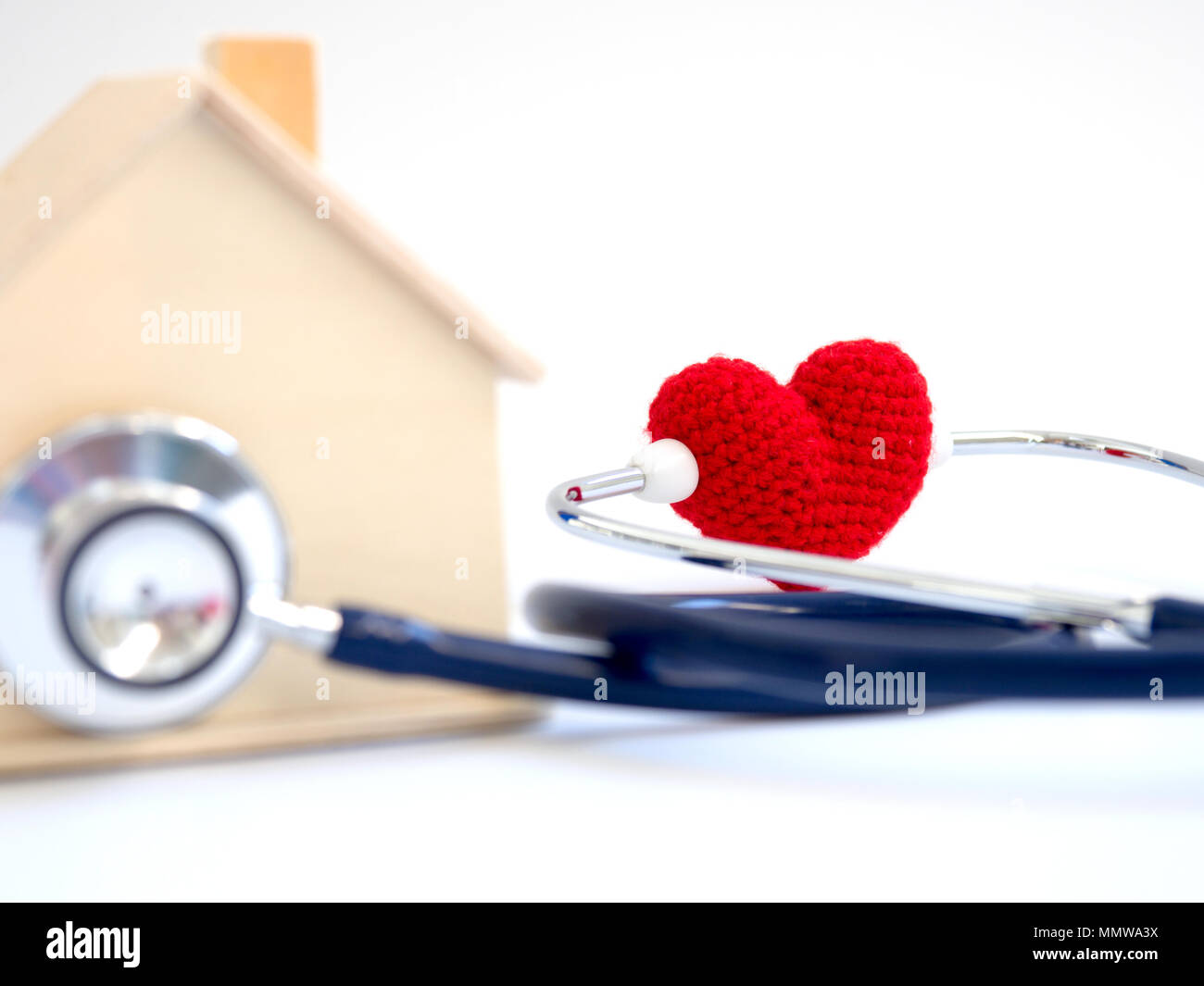 red heart using stethoscope on the blue background for house health ...