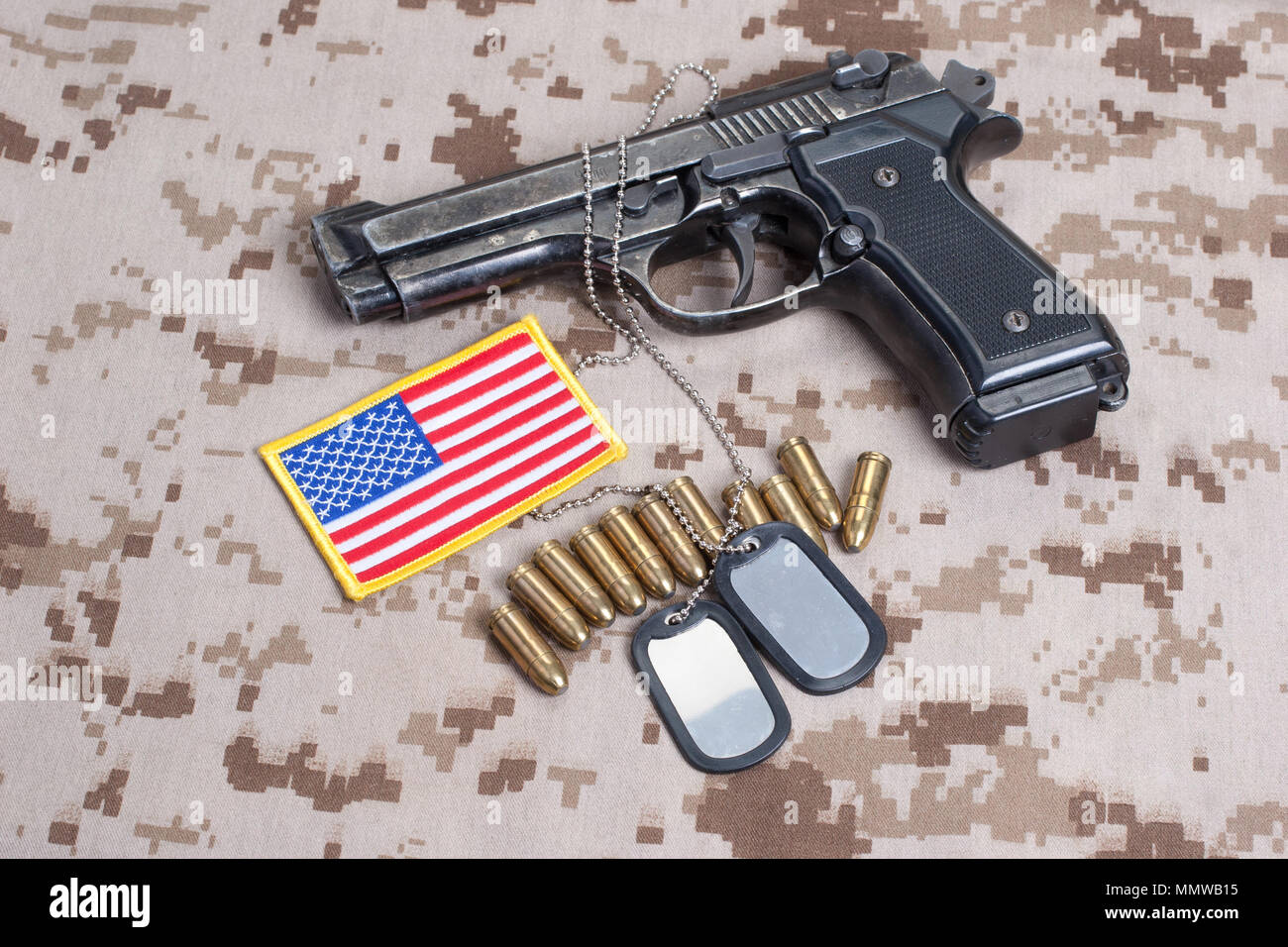 Beretta hand gun on desert marines uniform Stock Photo - Alamy