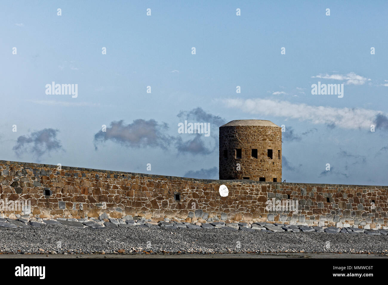 Loophole tower 12 behind the sea wall at Vazon Bay Stock Photo - Alamy