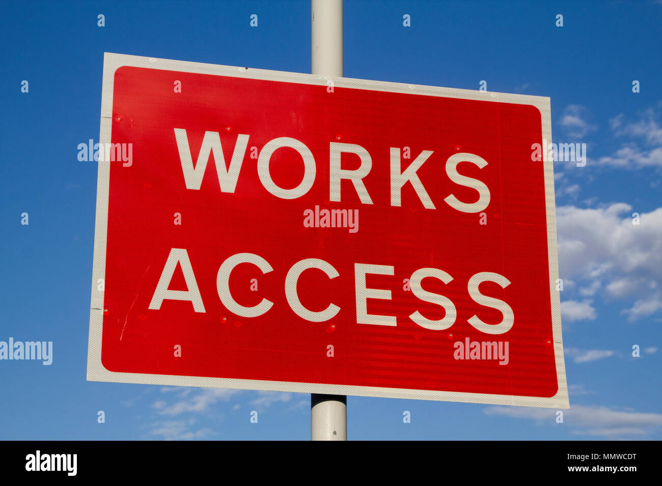 Red works access sign Stock Photo - Alamy