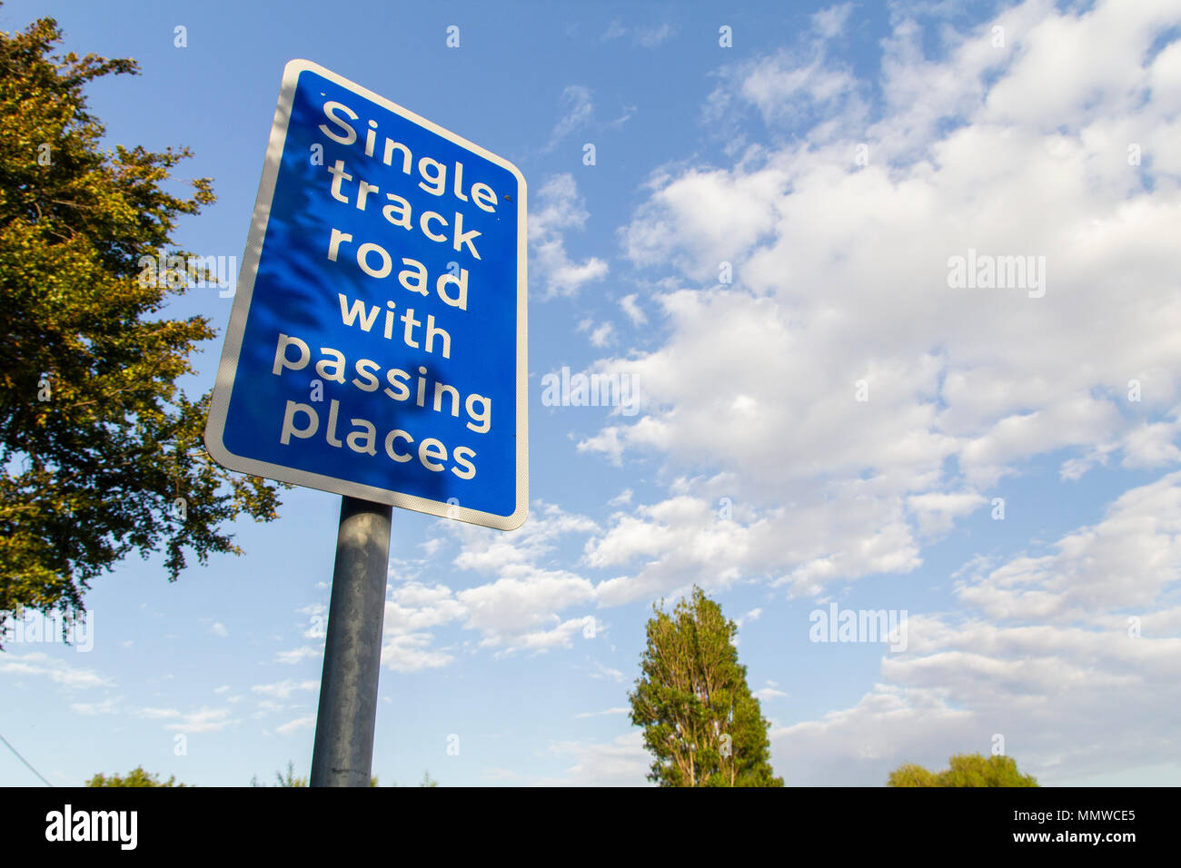 Blue single track road signl Stock Photo - Alamy