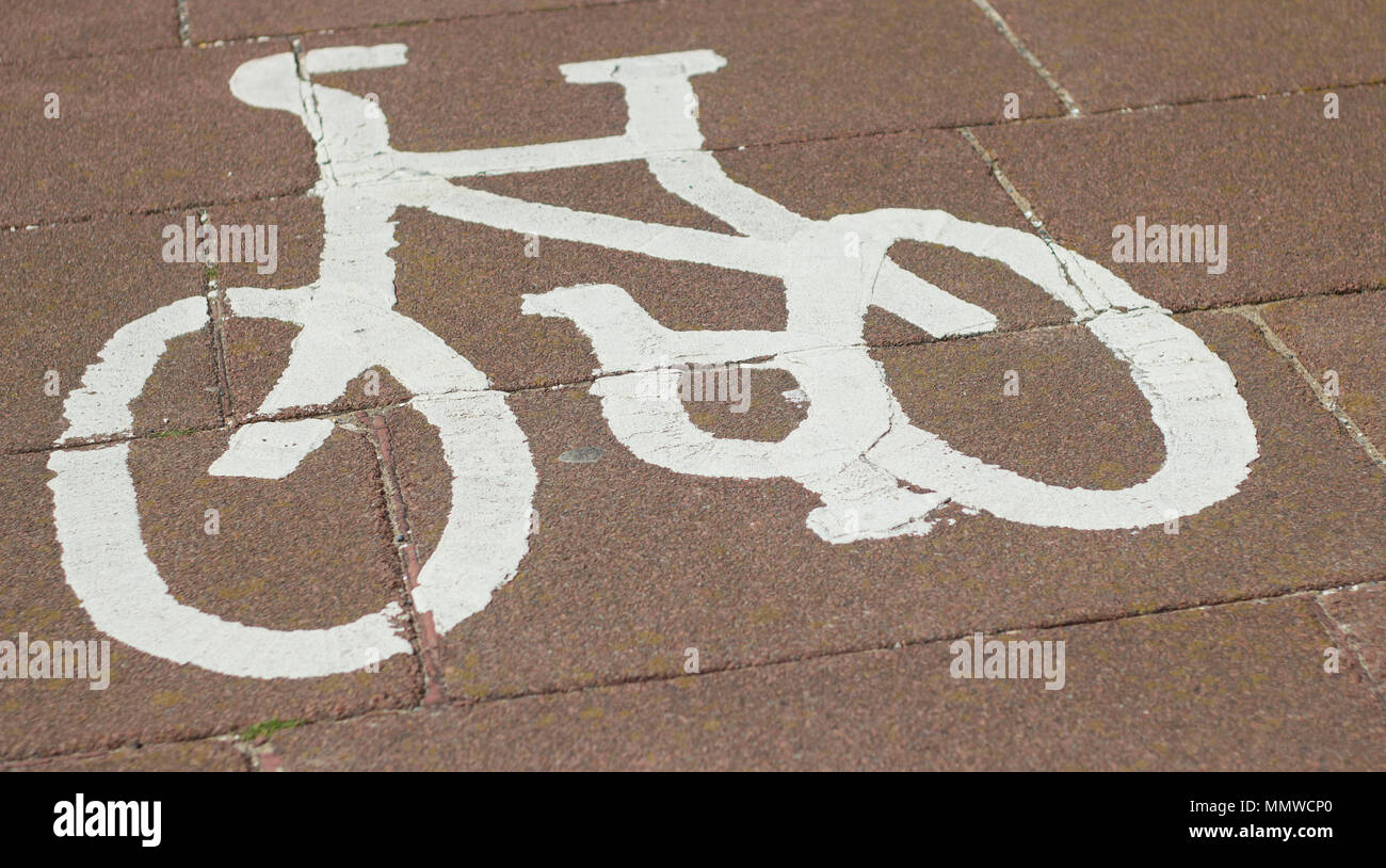 Picture of bicycle painted white on pavement to show cycle path Stock ...