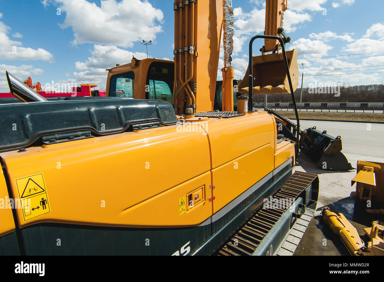 road-building machinery, tractors yellow excavators in the open air in ...