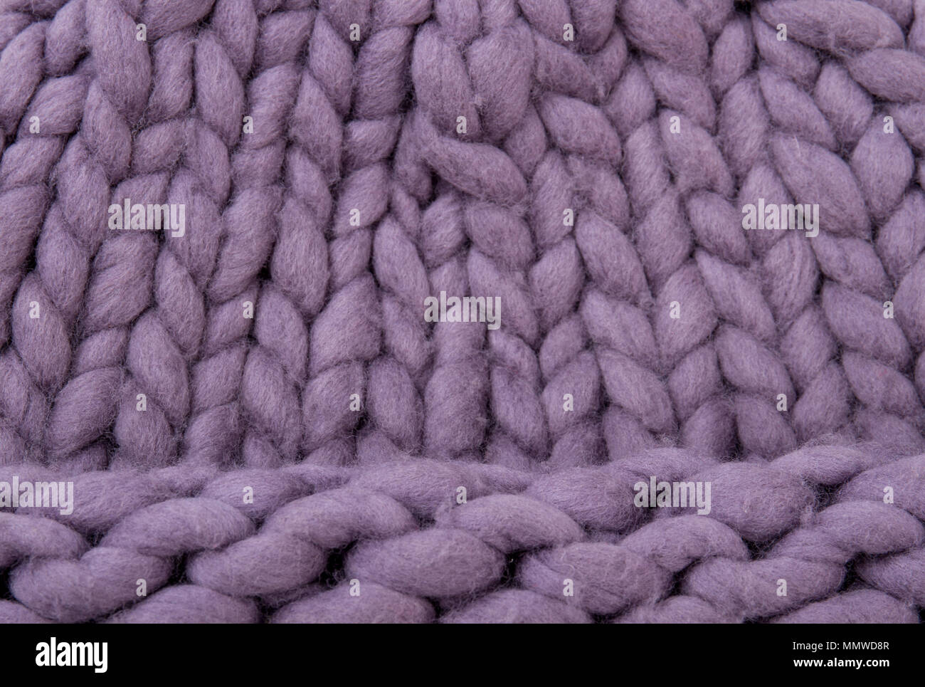 Close up female purple knitted winter hat Stock Photo - Alamy