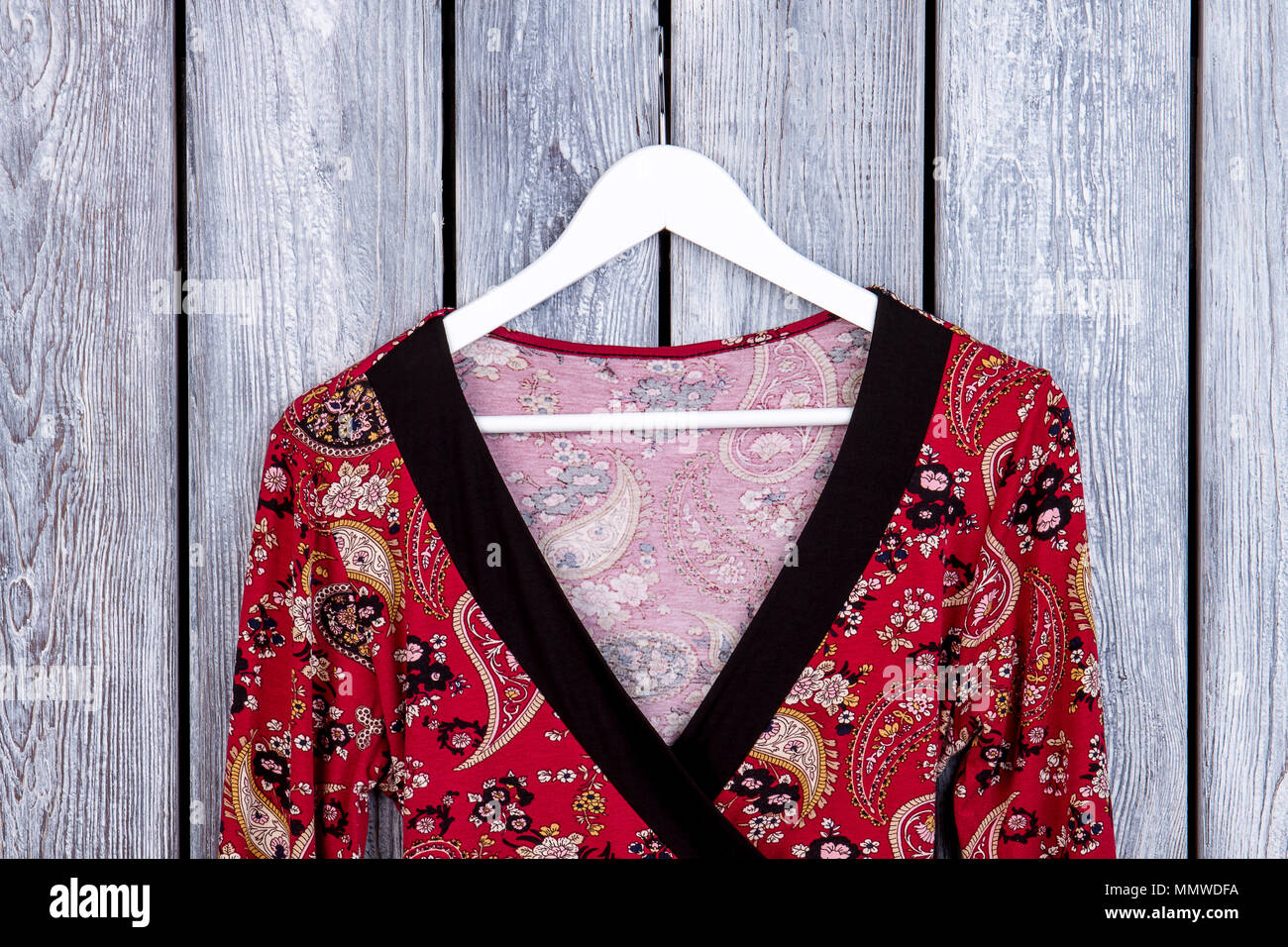 Feminine patterned clothes on hanger Stock Photo - Alamy