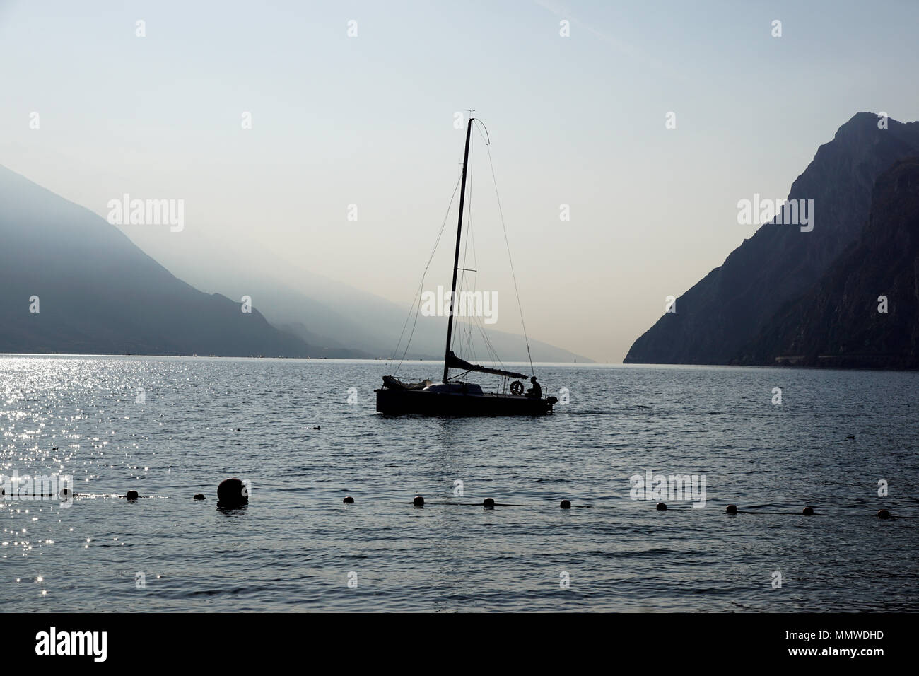 Boat wake on water surface in sunset light . lake view Stock Photo - Alamy